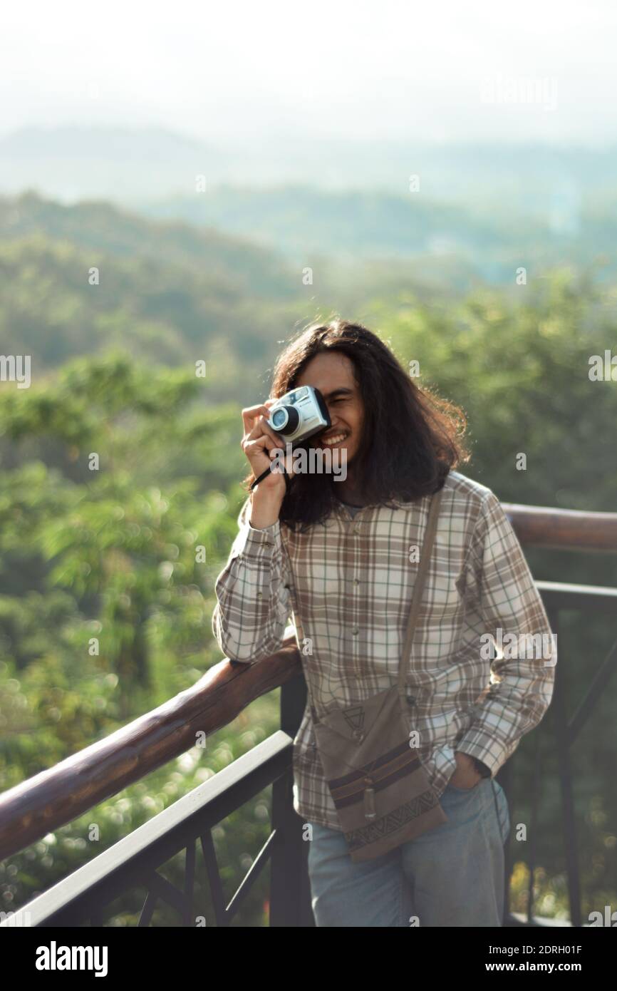 Young man standing railing observation hi-res stock photography and ...