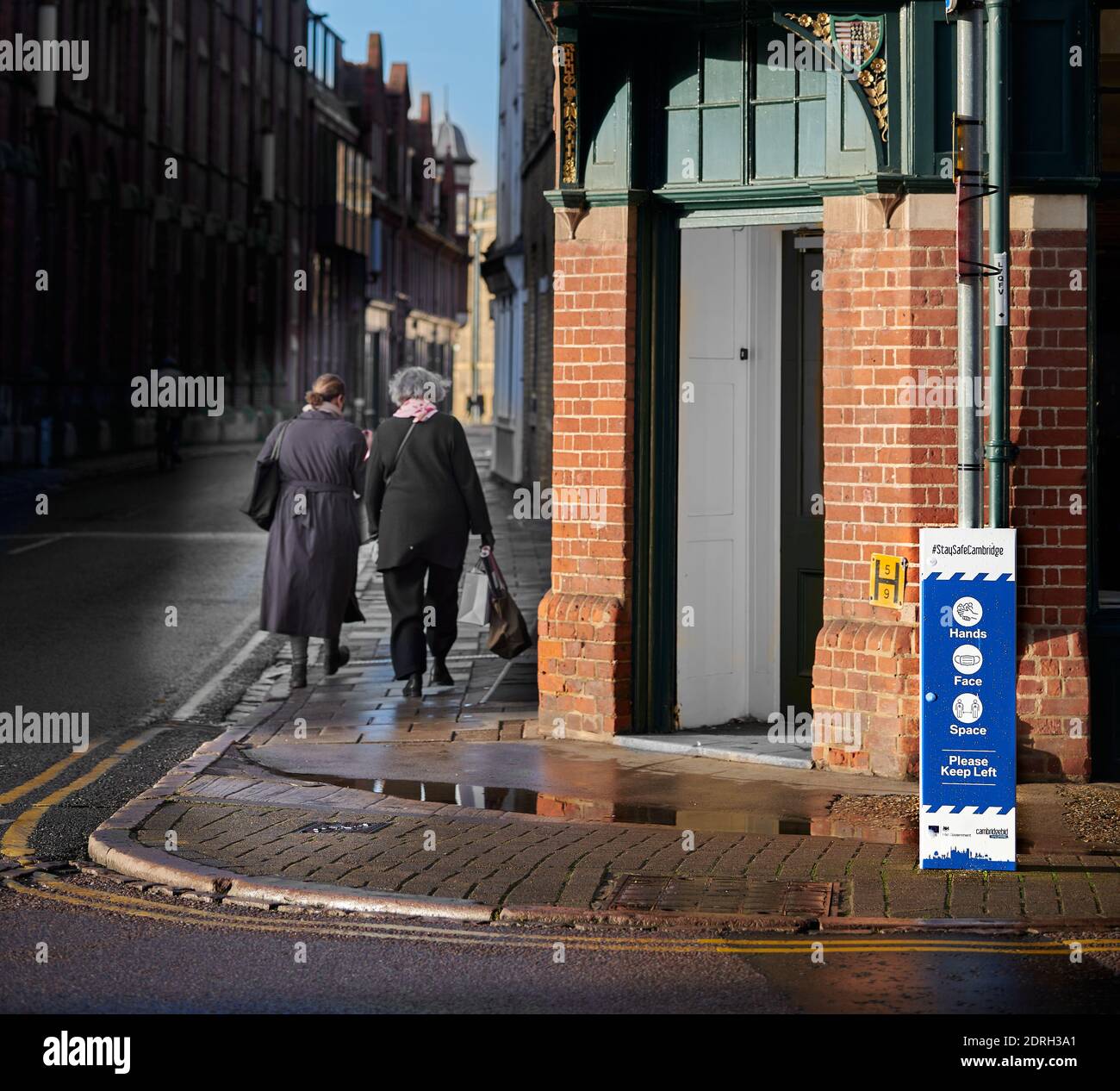 Stay safe notice (hands, face, space, and keep left) notice on a street ...