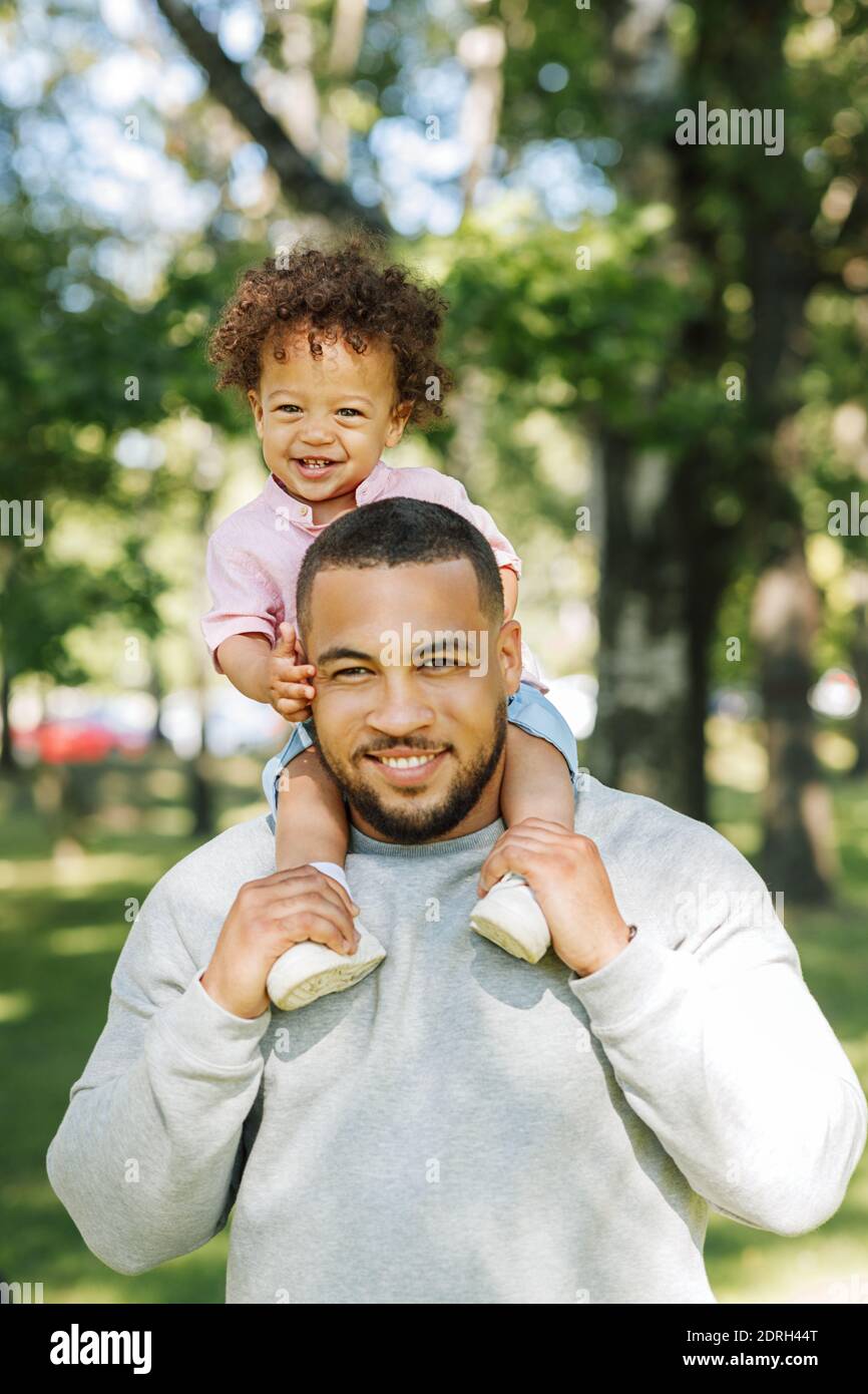 Men baby boy piggyback hi-res stock photography and images - Alamy