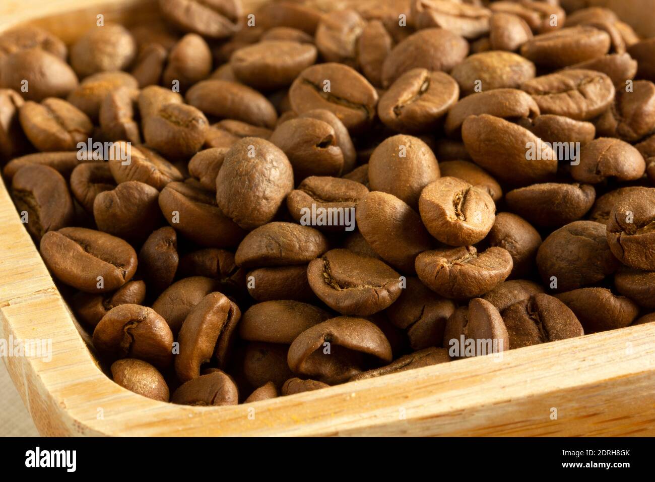 coffee beans on wooden plate Stock Photo - Alamy