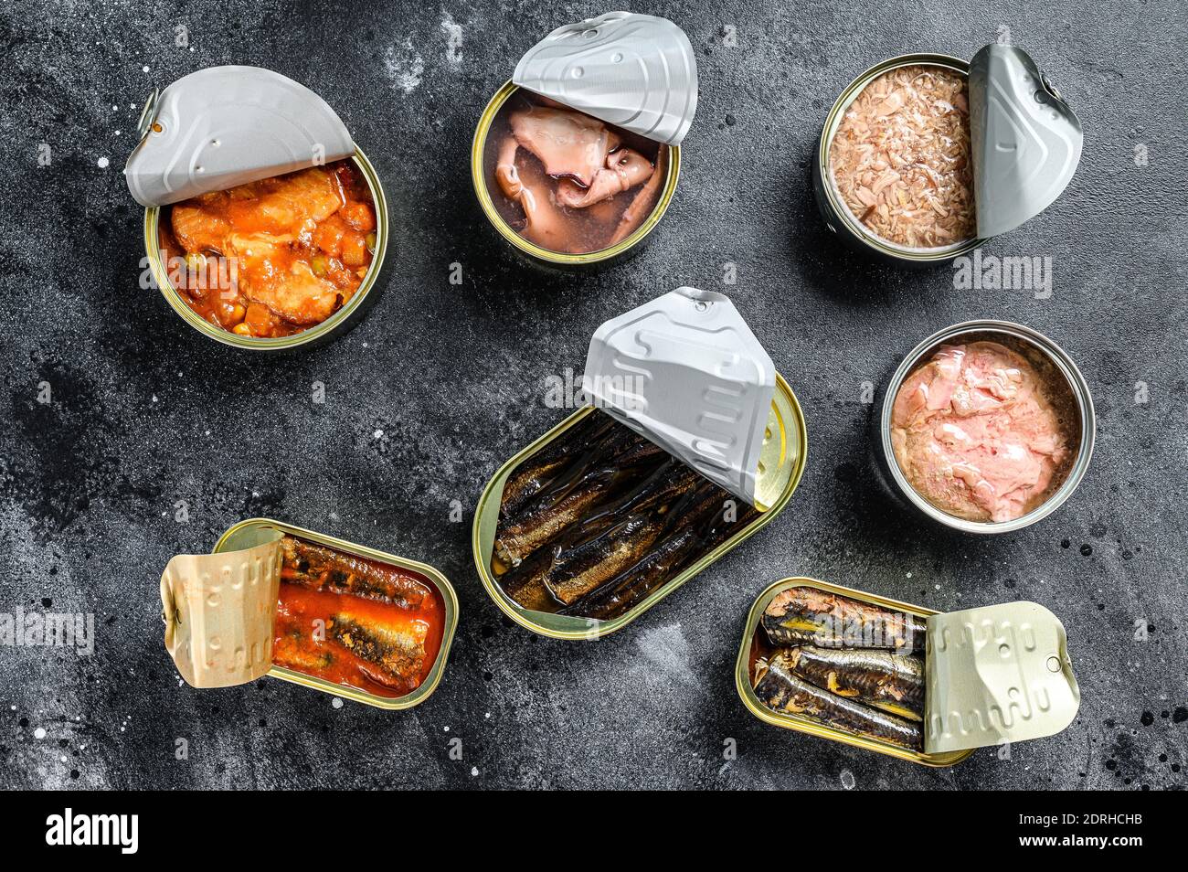 Assortment of cans, canned with different types of fish and seafood ...