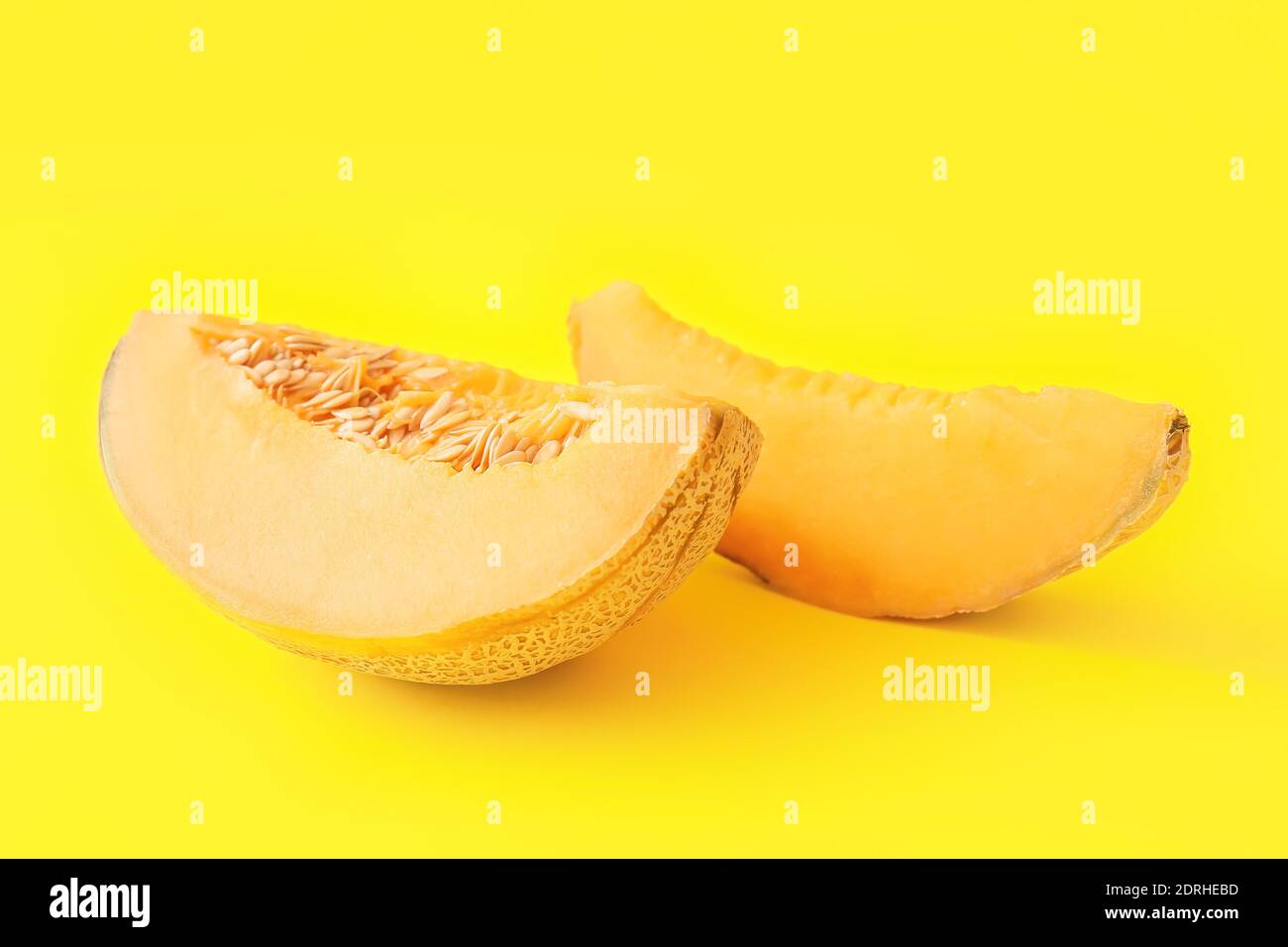 Sweet cut melon on color background Stock Photo - Alamy