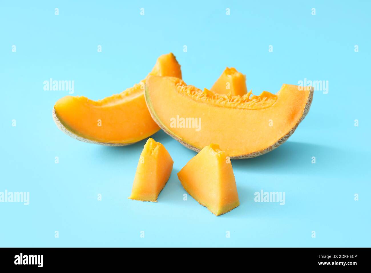 Sweet cut melon on color background Stock Photo - Alamy