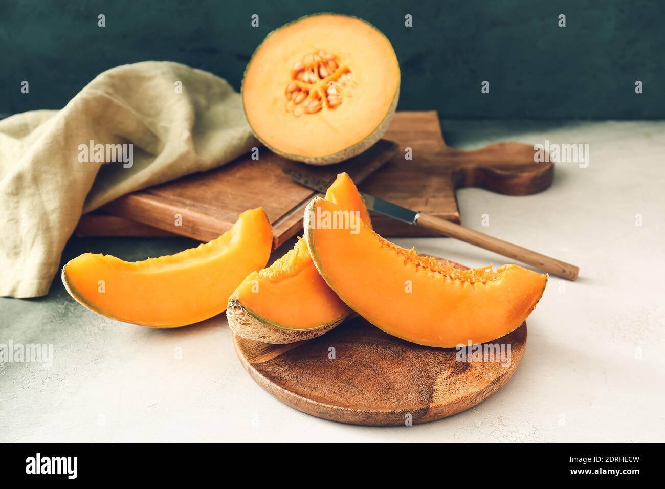 Sweet cut melon on table Stock Photo - Alamy