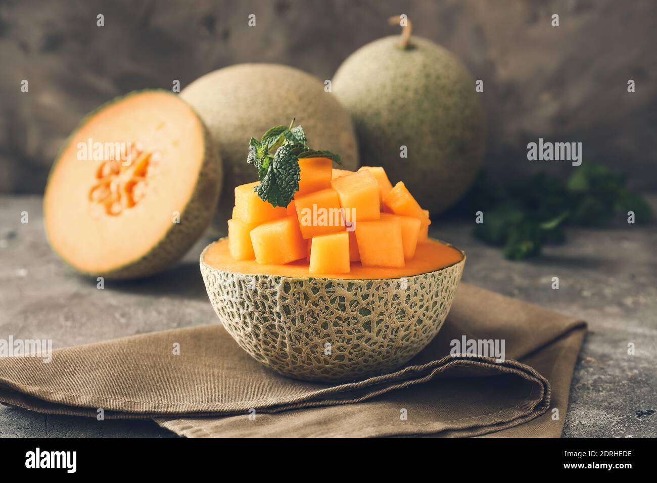 Sweet cut melon on table Stock Photo - Alamy