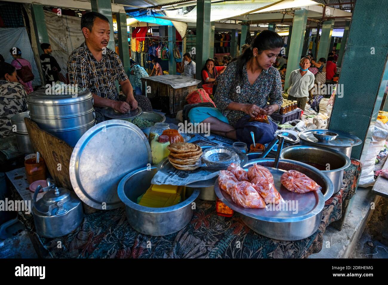Kalimpong, India - October 2020: A woman selling food at the Haat ...