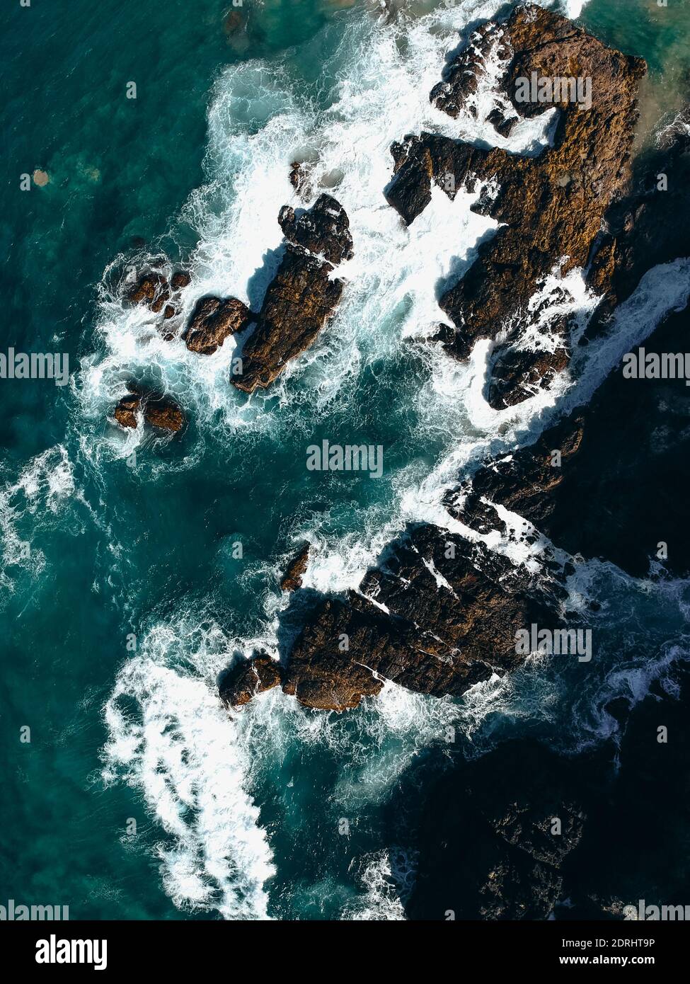 Aerial View Of Rocks In Sea Stock Photo - Alamy