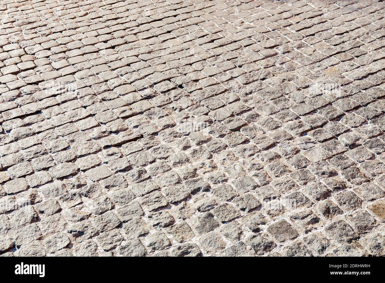 Old rough stone pavement background Stock Photo - Alamy