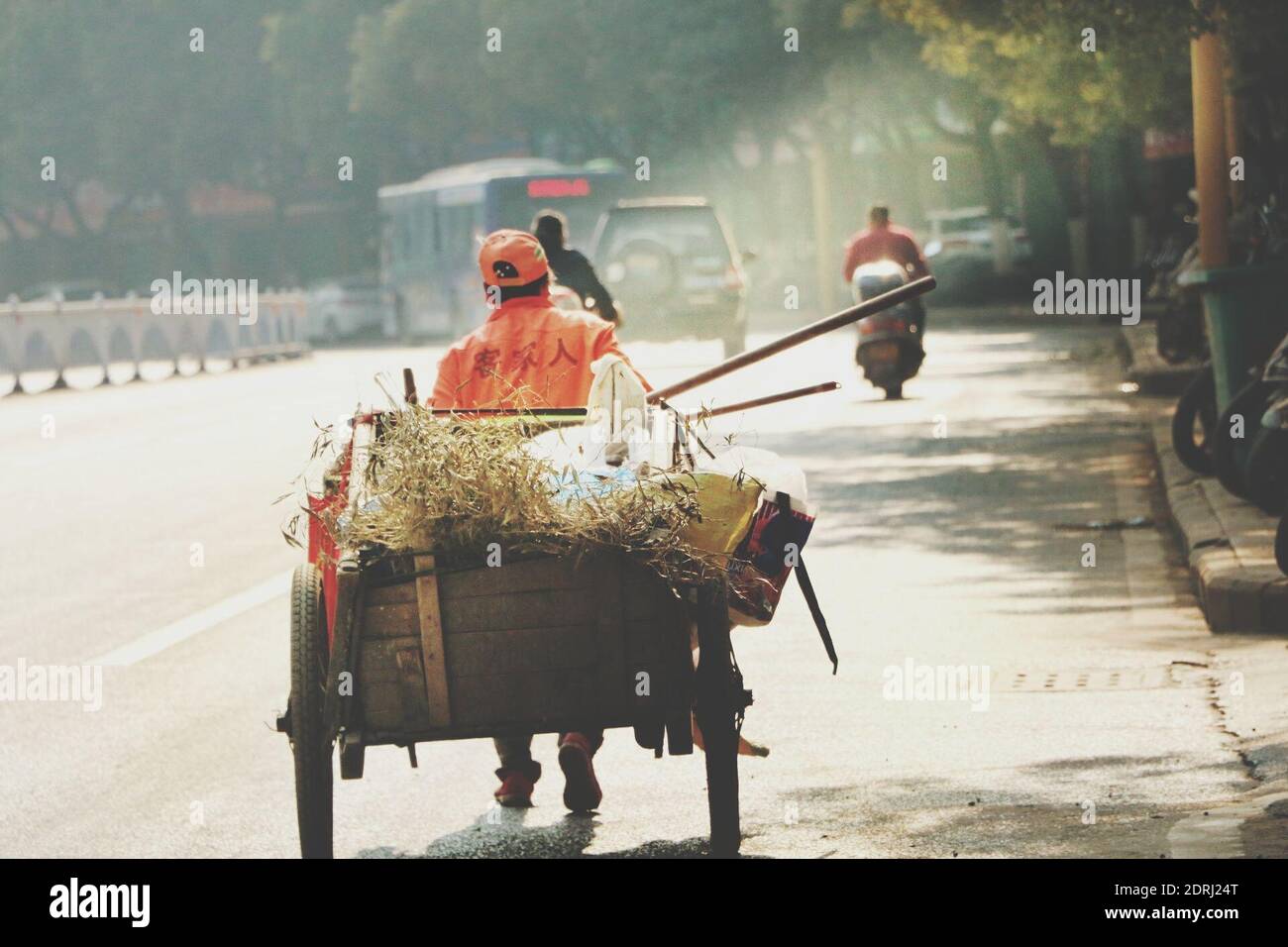 Man Driving Cart On Road In City Stock Photo - Alamy