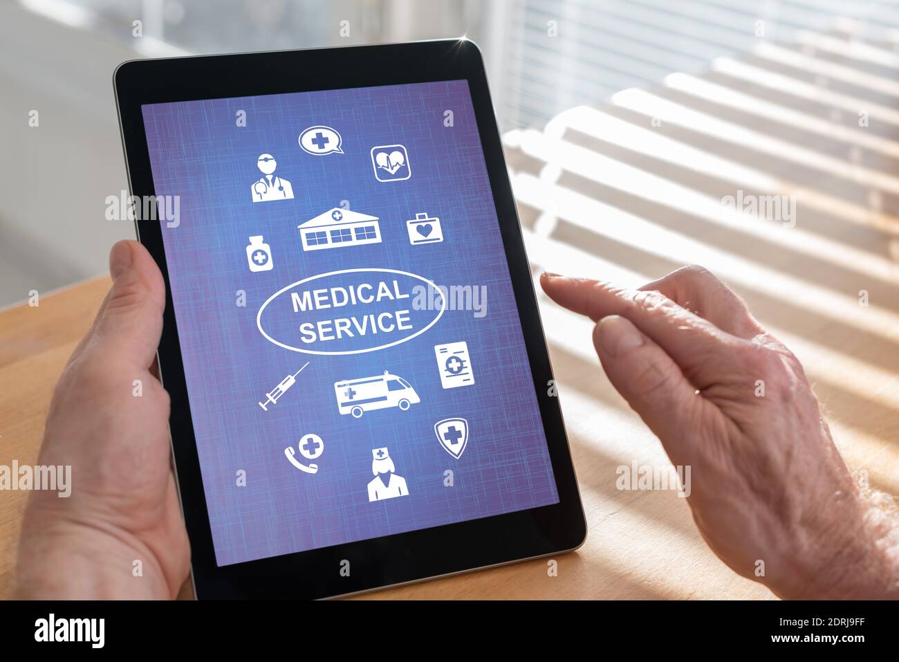 Tablet screen displaying a medical service concept Stock Photo - Alamy