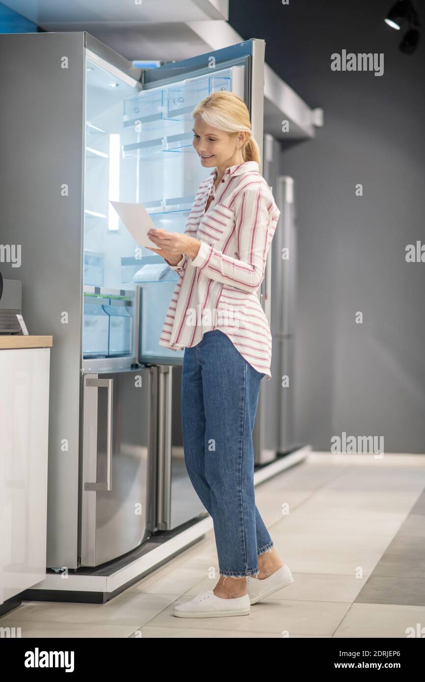 Modern woman and fridge hi-res stock photography and images - Alamy