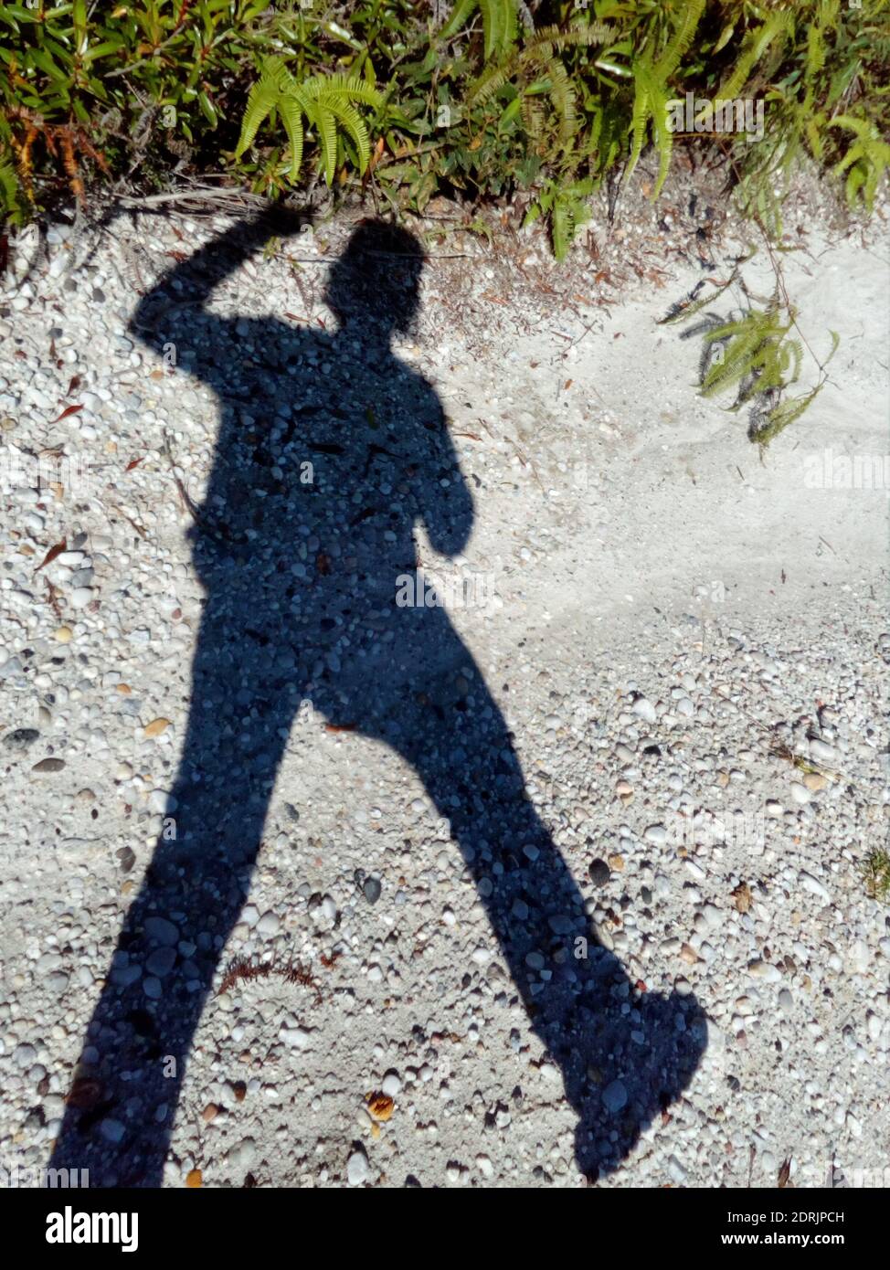 Shadow Of Man On Ground Stock Photo - Alamy