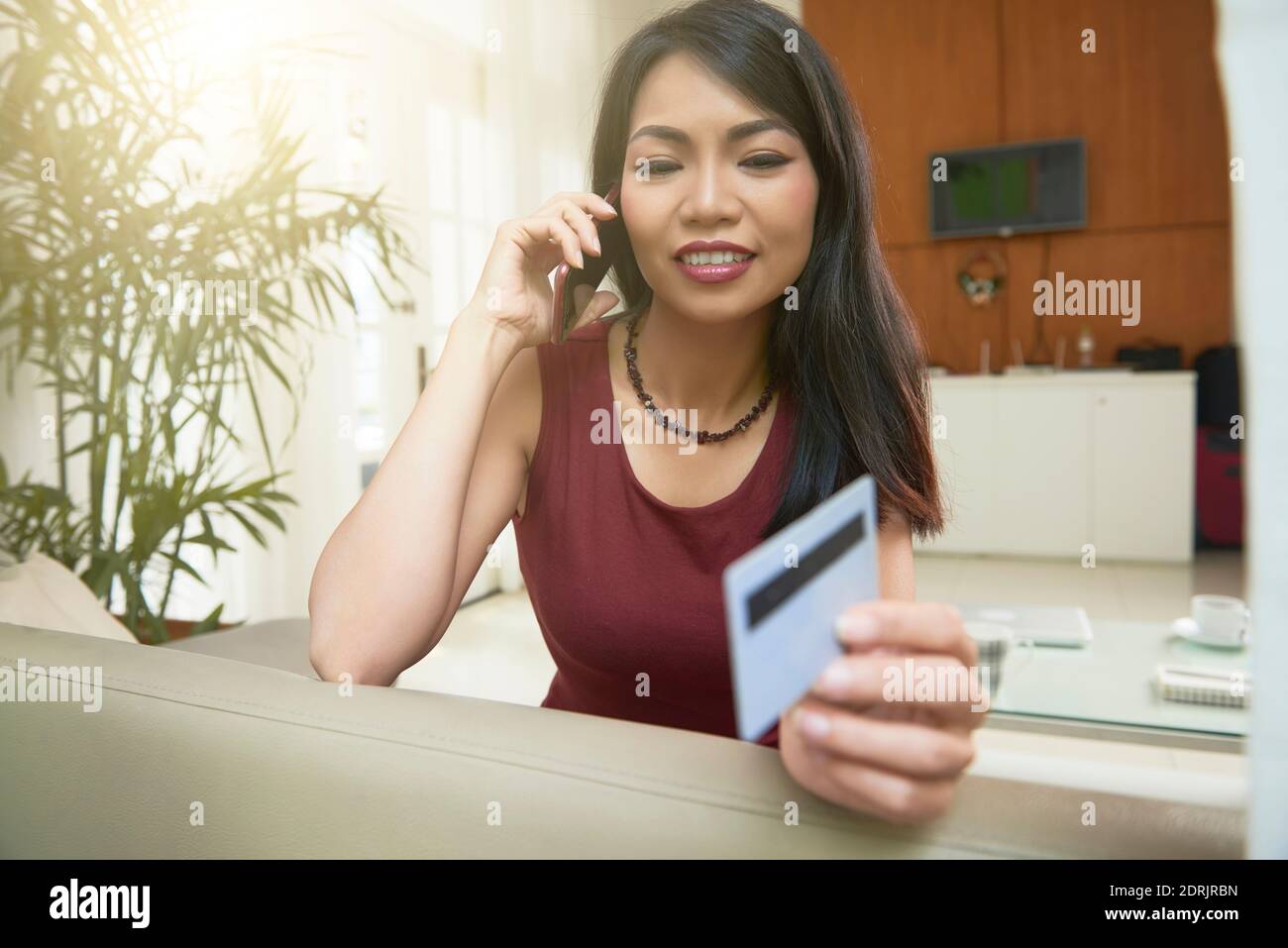 Talking on phone with bank manager Stock Photo - Alamy