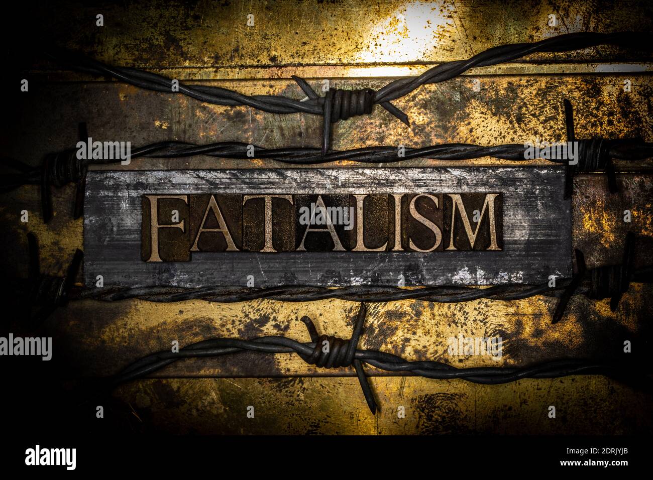 Fatalism text between barbed wire on vintage textured grunge copper and ...