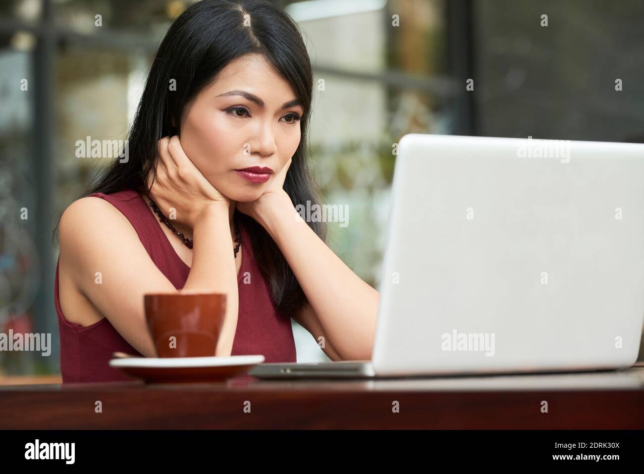 Businesswoman reading article Stock Photo - Alamy