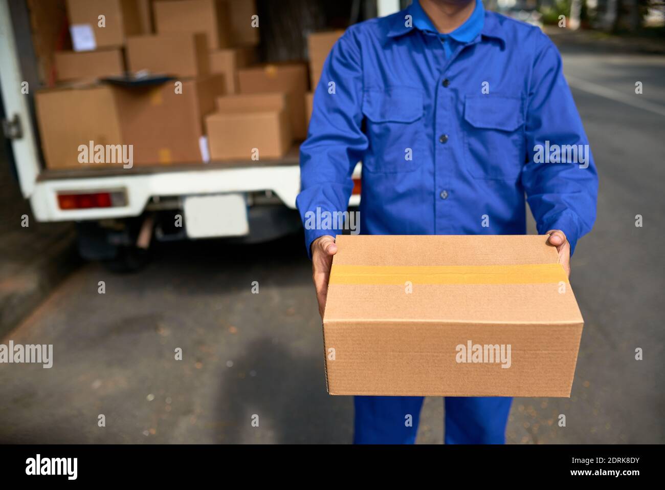 Delivering parcel to customer Stock Photo - Alamy
