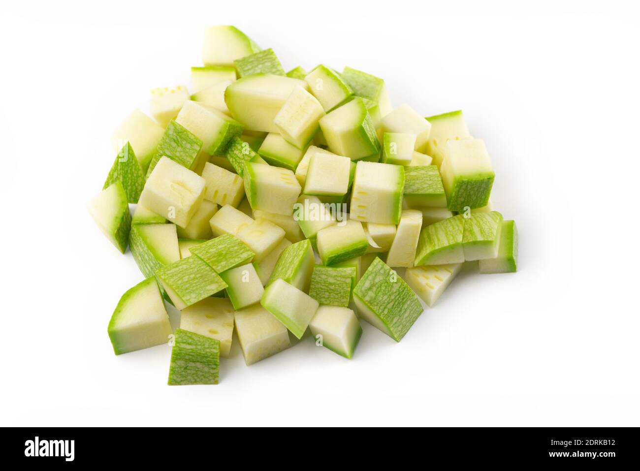 Handful of freshly chopped green squash on white background Stock Photo ...