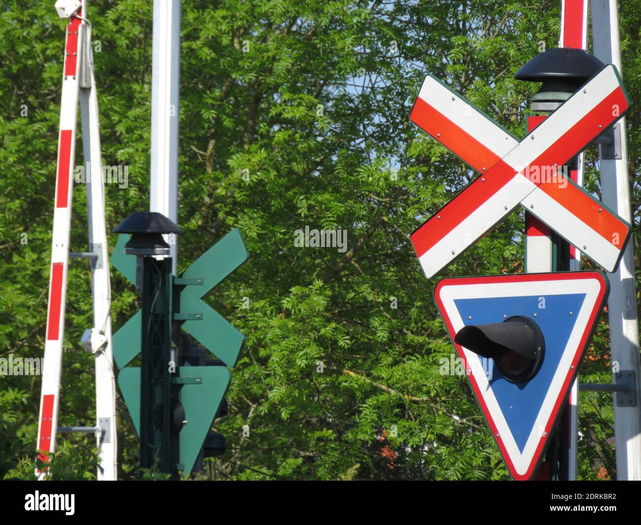 Railroad Crossing Sign Against Trees Stock Photo - Alamy