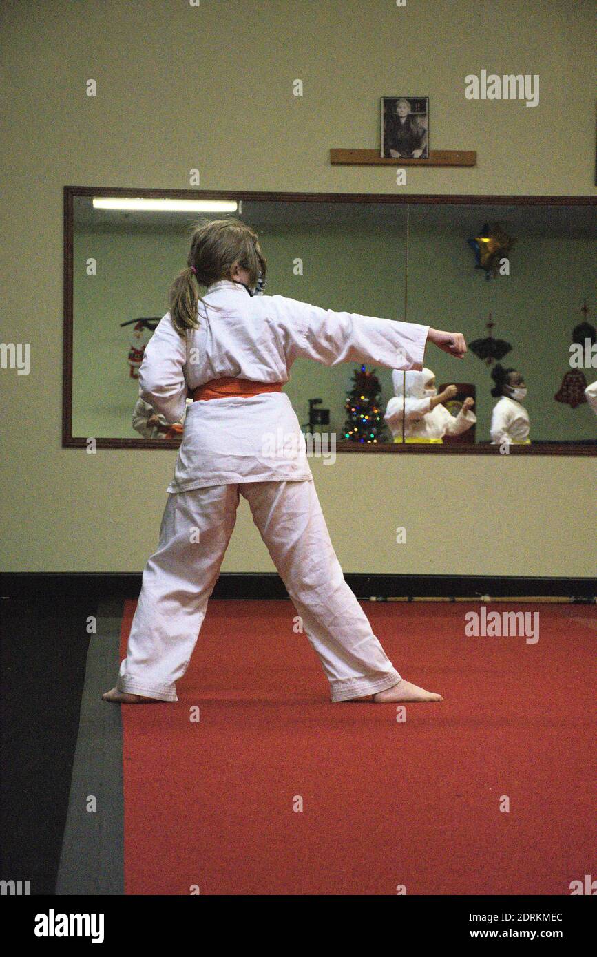 This action photo is of my daughter in her Karate class. Karate is a ...