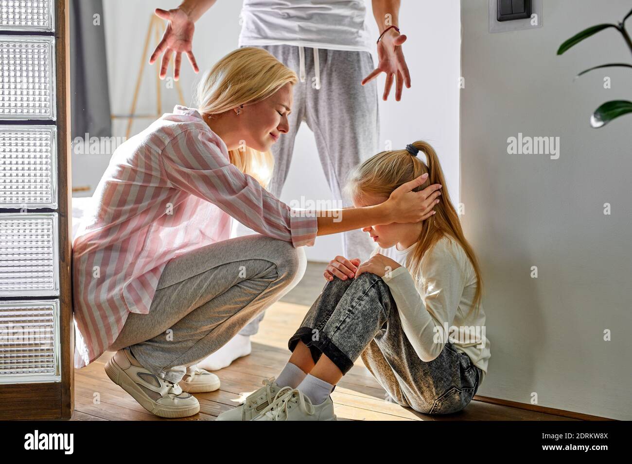 kid girl is suffering from quarrels between parents in the family at ...