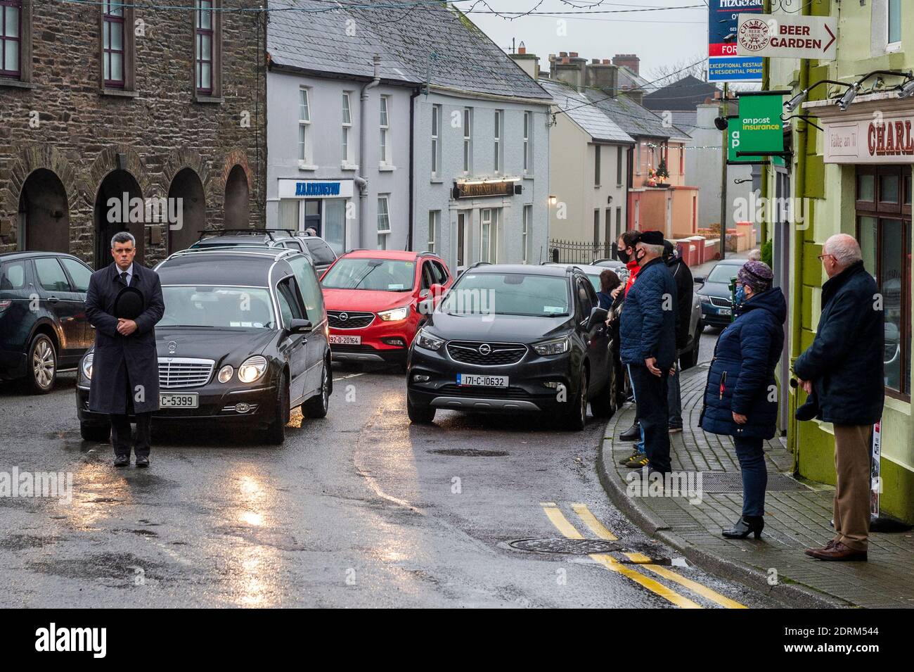 Timoleague, West Cork, Ireland. 21st Dec, 2020. The hearse carrying the ...
