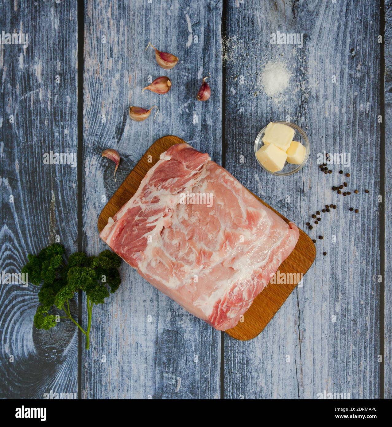 A top view of a block of raw pork meat on a board Stock Photo - Alamy