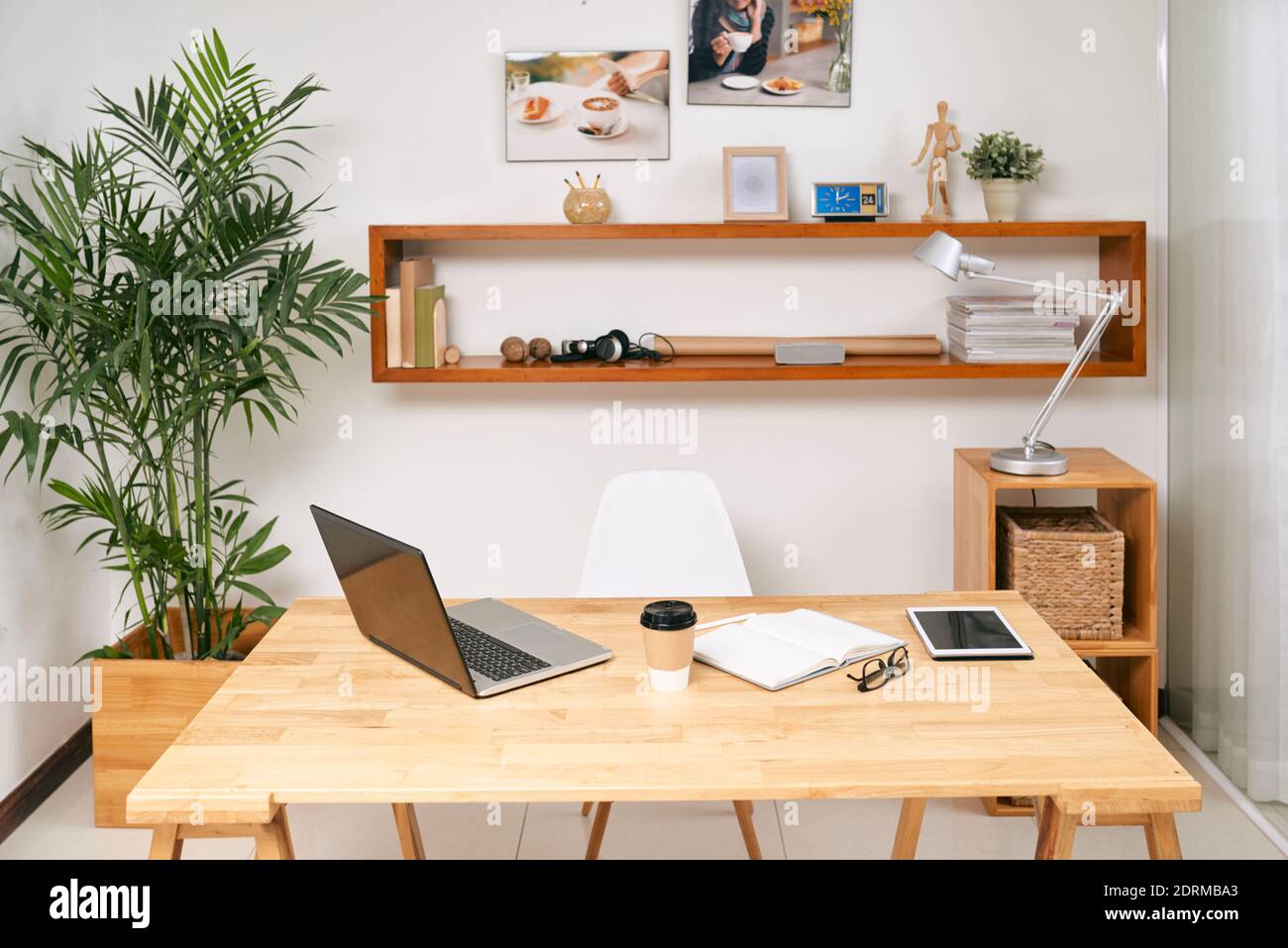 Office table with laptop and planner Stock Photo - Alamy