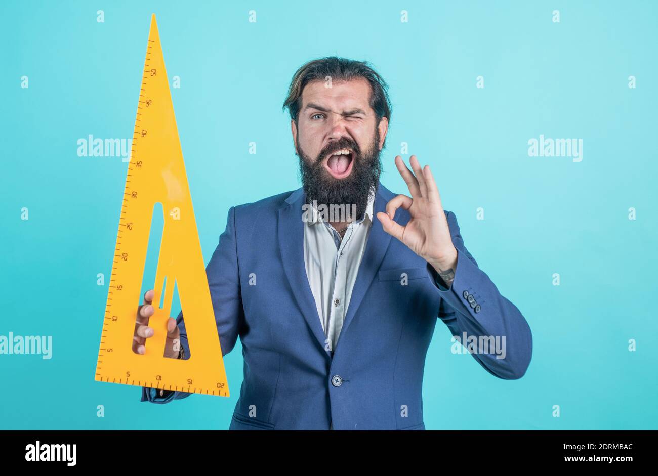 brutal unshaven guy university lecturer with math triangle ruler, study ...