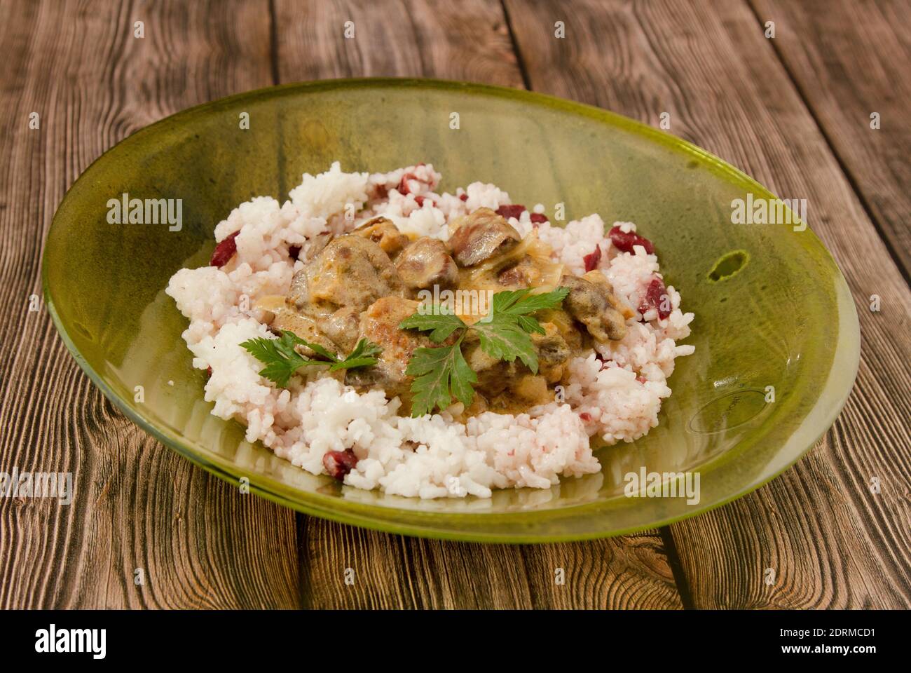 A closeup shot of a bowl of rice with beans and chicken liver Stock ...