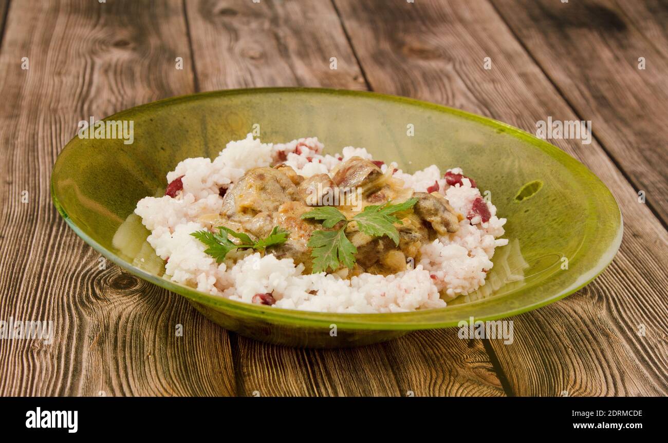 A closeup shot of a bowl of rice with beans and chicken liver Stock ...