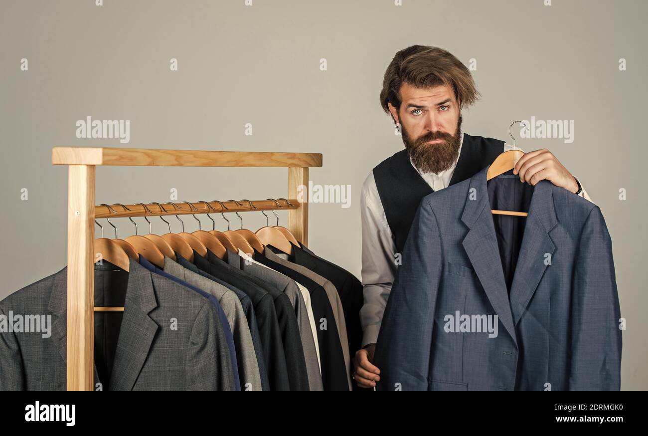 Bearded man collector vintage clothes showing formal suit, retro stock ...