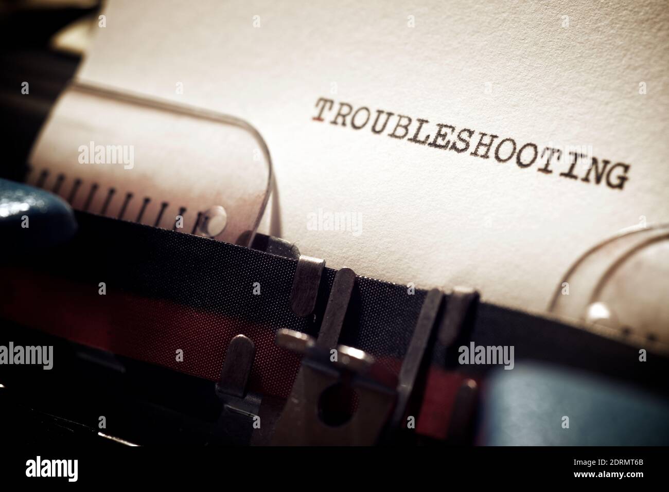 Troubleshooting word written with a typewriter Stock Photo - Alamy