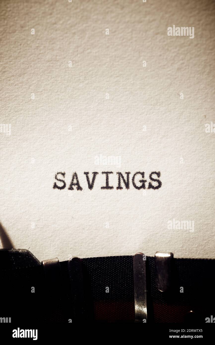 Savings word written with a typewriter Stock Photo - Alamy
