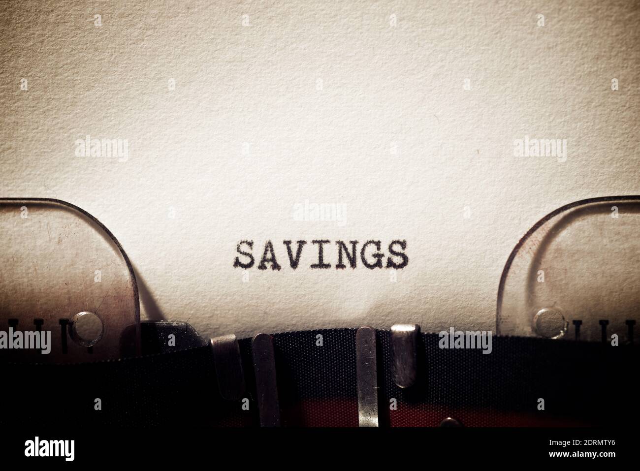Savings word written with a typewriter Stock Photo - Alamy