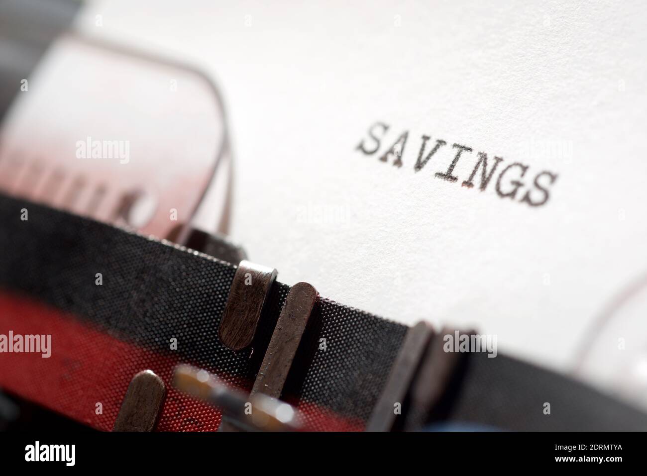 Savings word written with a typewriter Stock Photo - Alamy