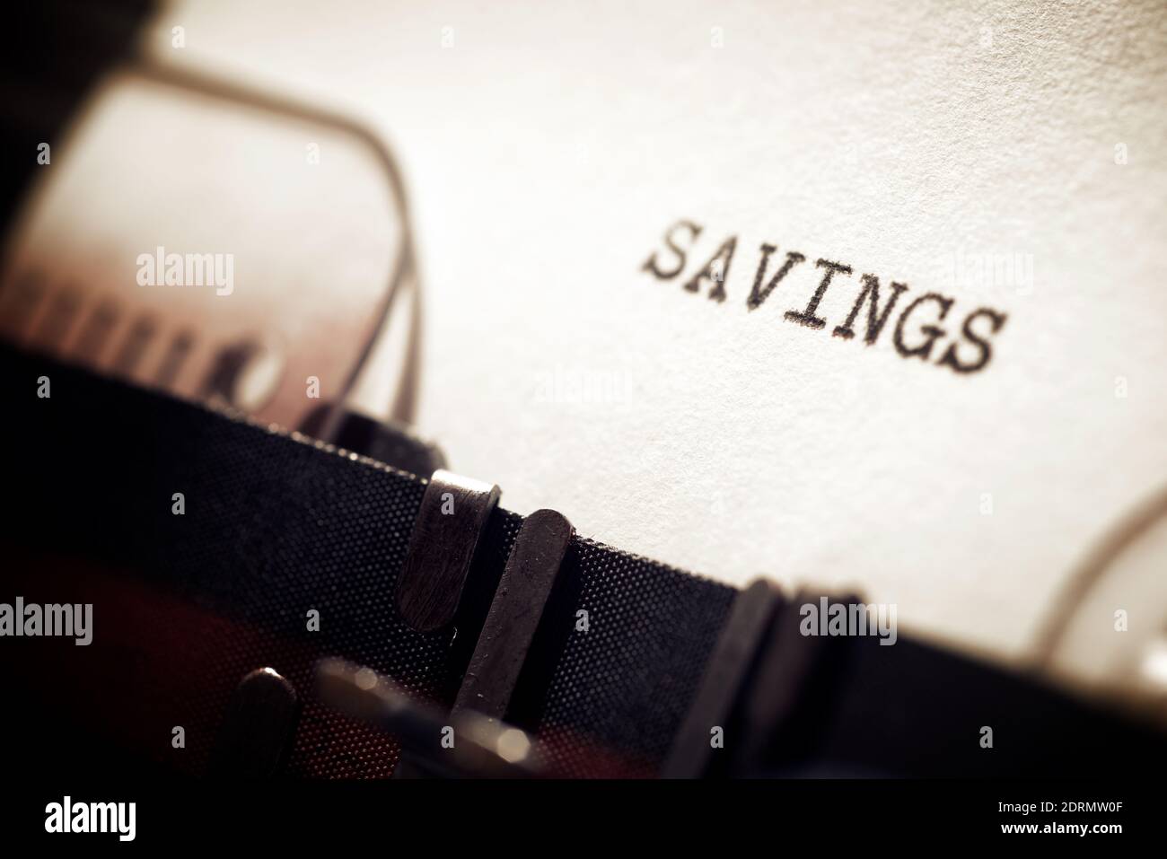 Savings word written with a typewriter Stock Photo - Alamy