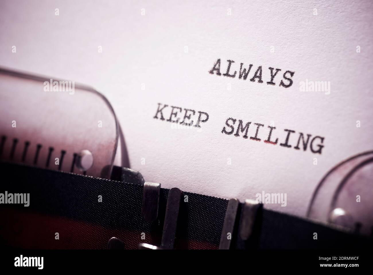 Always keep smiling phrase written with a typewriter Stock Photo - Alamy