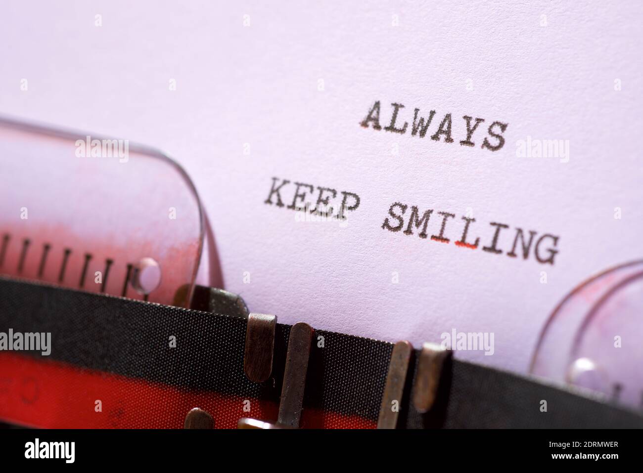 Always keep smiling phrase written with a typewriter Stock Photo - Alamy