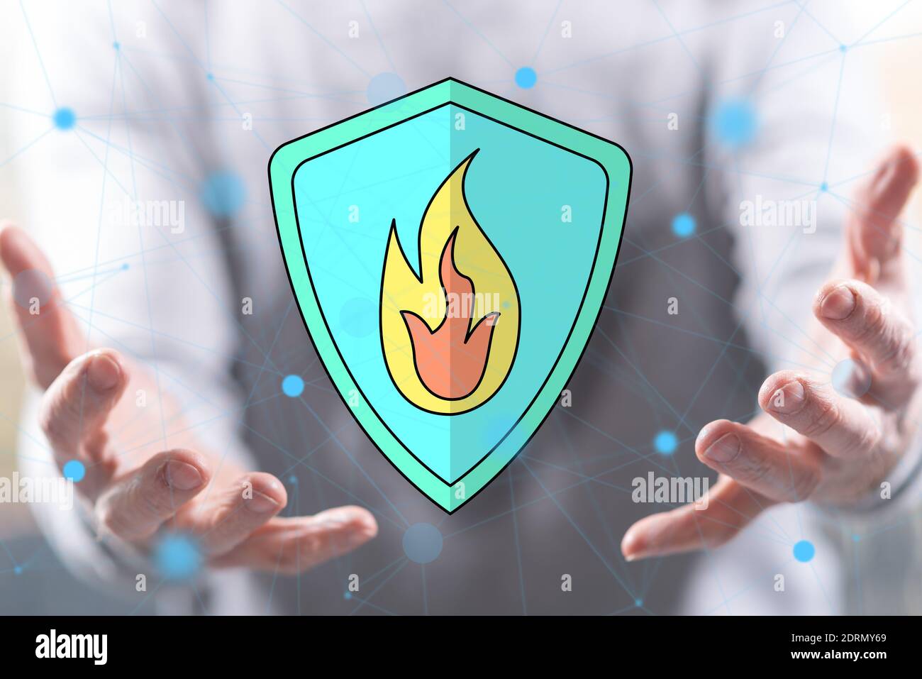 Fire protection concept above the hands of a man in background Stock ...