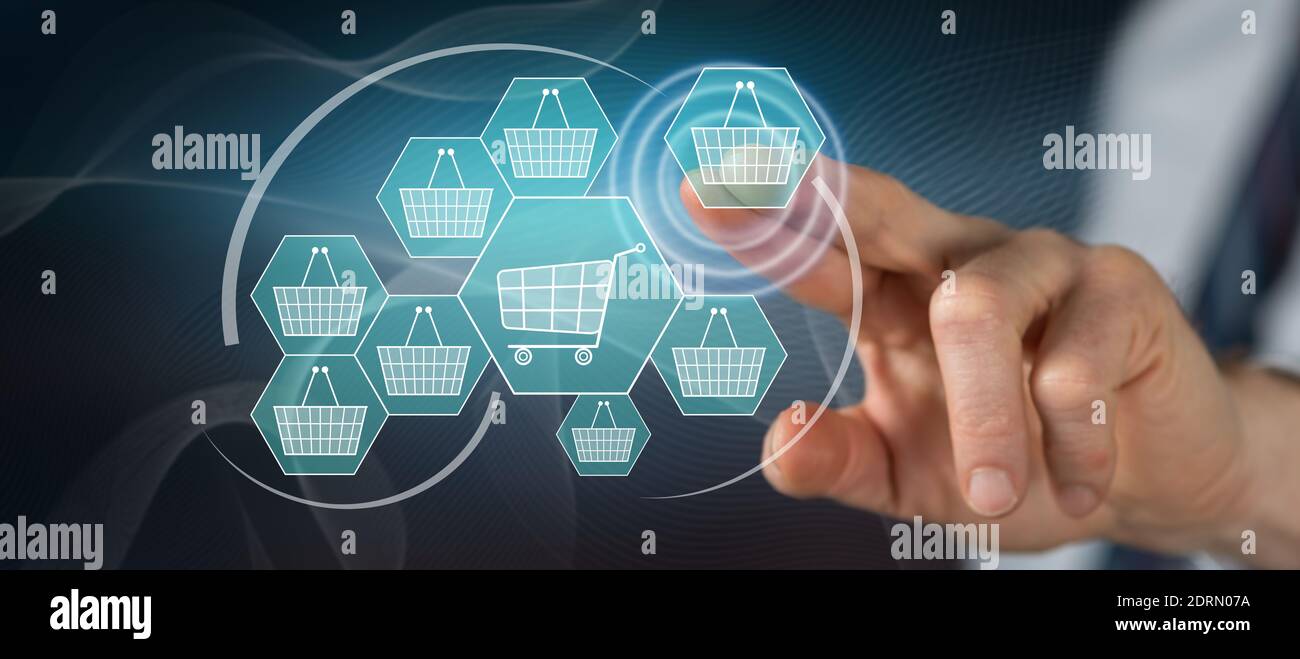 Man touching an online shopping concept on a touch screen with his ...