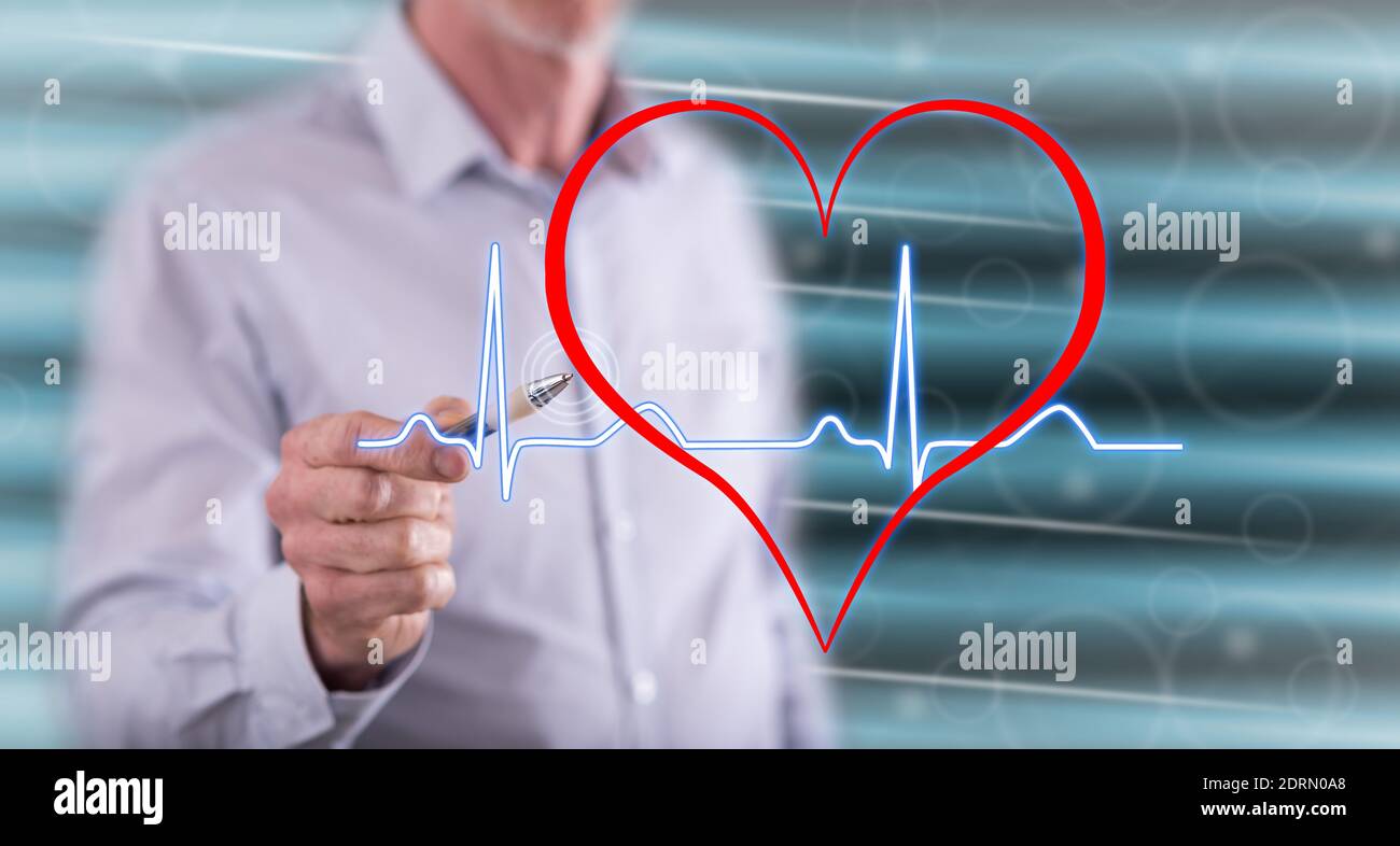 Man touching a heart beats graph on a touch screen with a pen Stock ...