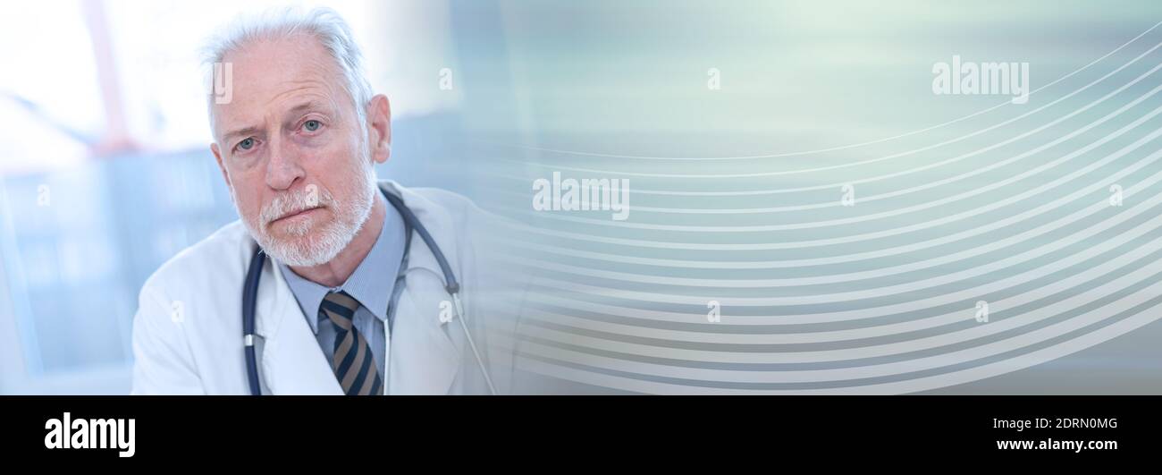 Portrait of male senior doctor looking the camera; panoramic banner ...