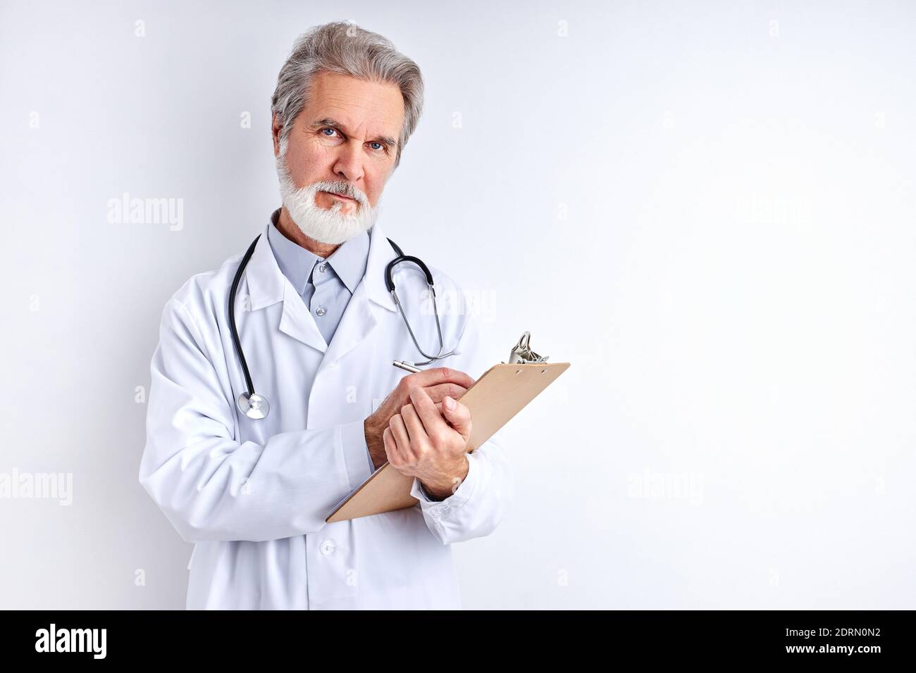 old experienced caucasian doctor ariting symptoms and diagnose, use ...