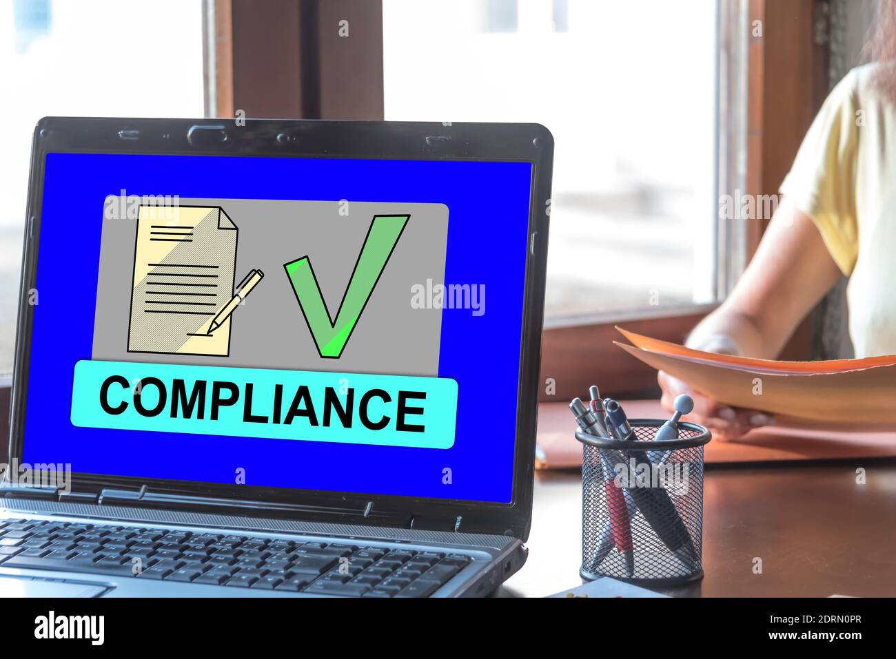 Laptop screen displaying a compliance concept Stock Photo - Alamy
