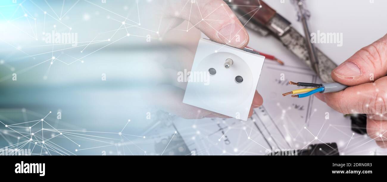 Hand holding an electrical outlet and a power cable, light effect Stock ...
