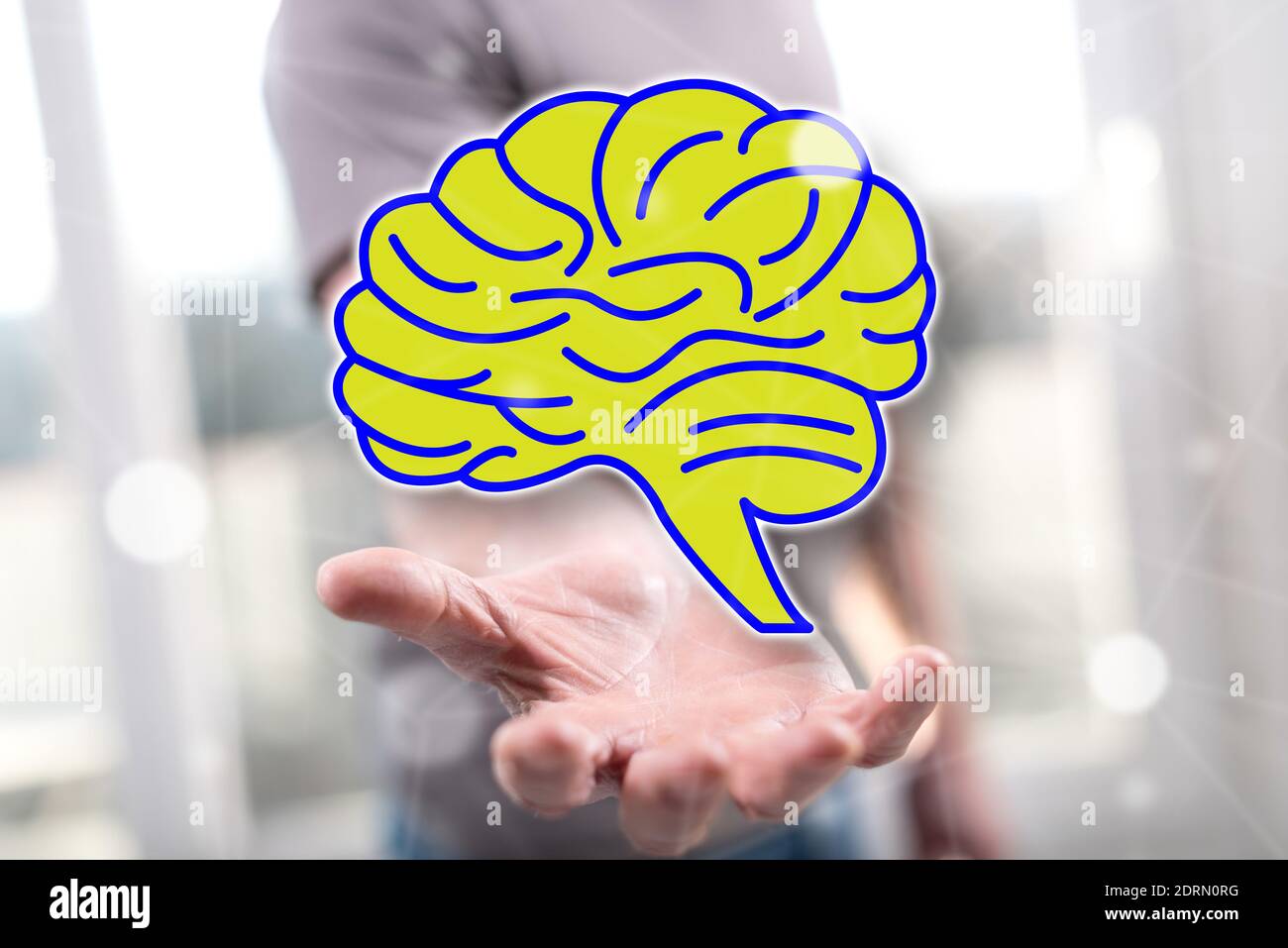 Human mind concept above the hand of a man in background Stock Photo ...