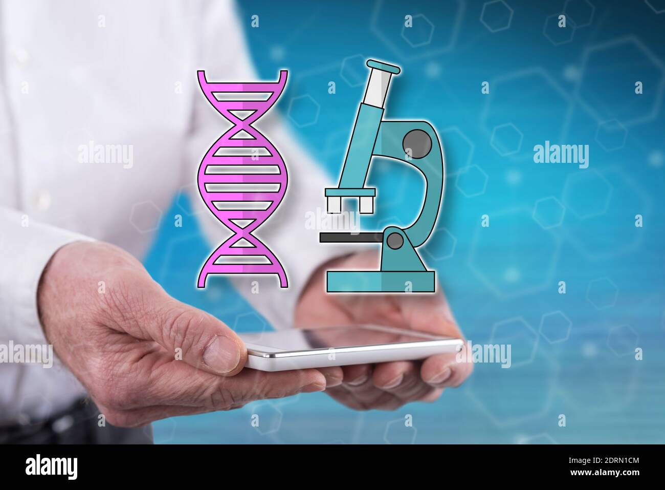 Dna technology concept above a smartphone held by hands Stock Photo - Alamy