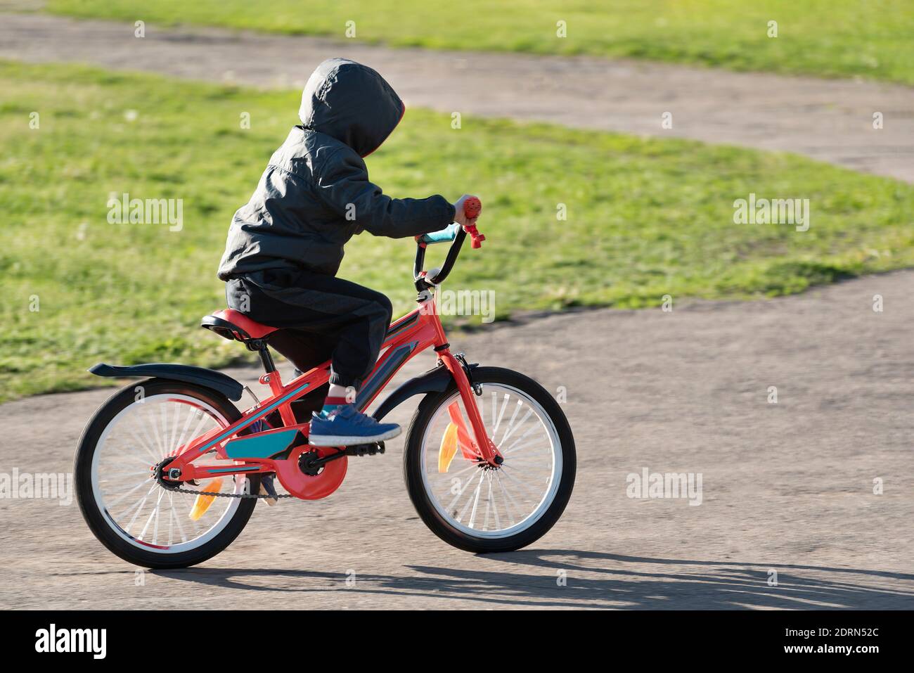 Child riding Bicycle. Boy learning to ride a bike Stock Photo - Alamy