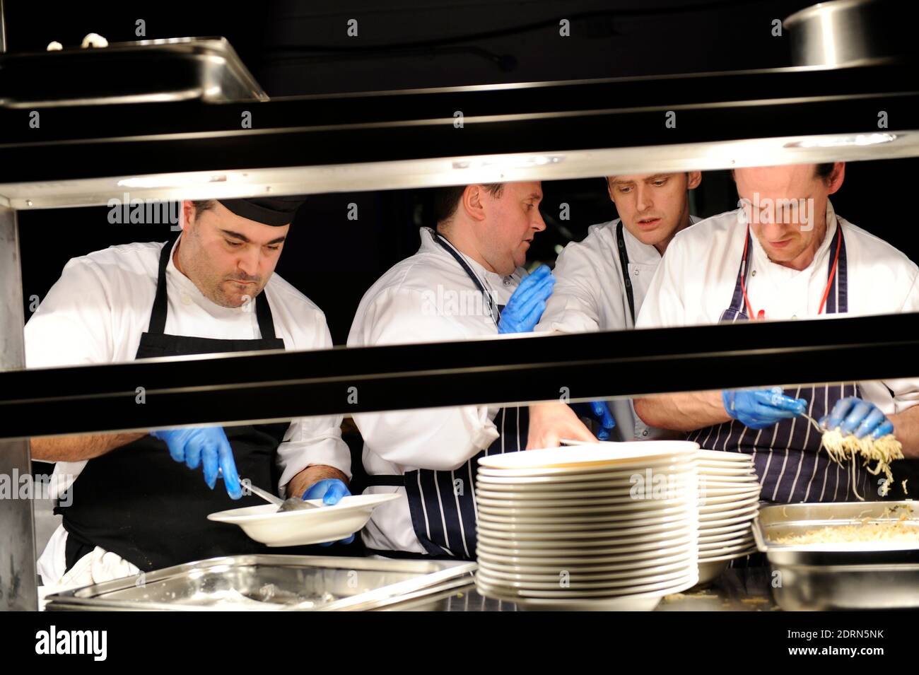 Chefs Working in a Restaurant Kitchen Preparing Food Stock Photo - Alamy