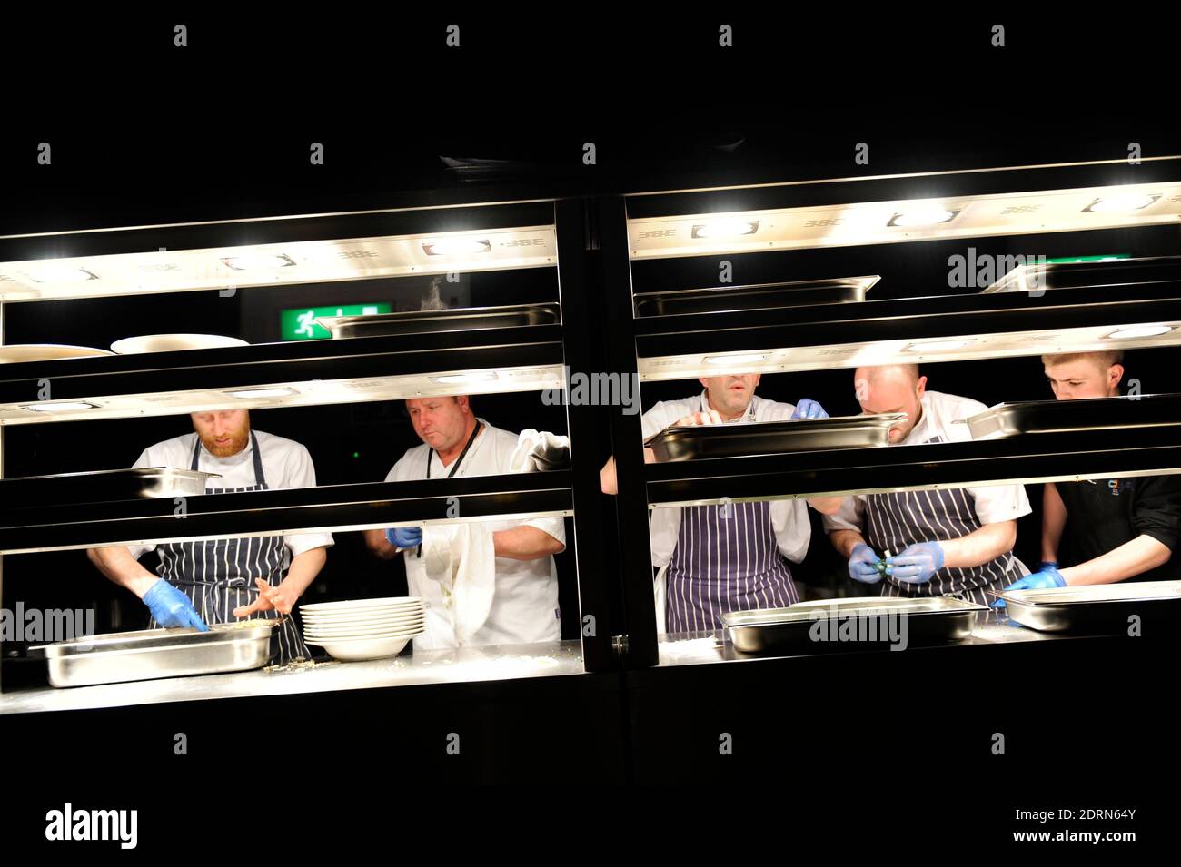 Chefs Working in a Restaurant Kitchen Preparing Food Stock Photo - Alamy